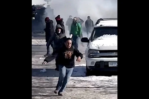 Woman thinks it’s a good idea to grab a flashbang and try to throw it ...